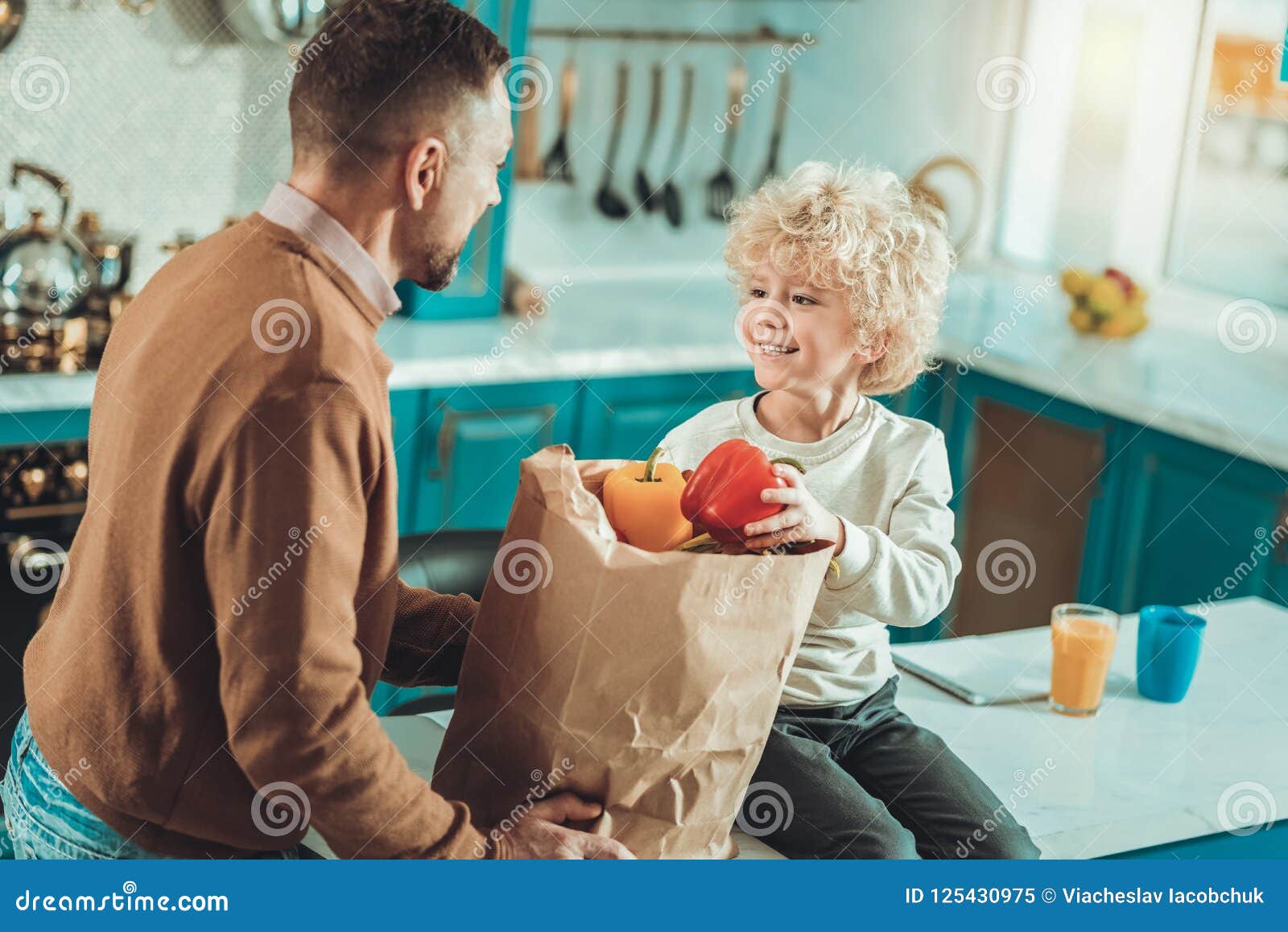 Small Kid Sitting on the Table in Gthe Kitchen Stock Image - Image of ...