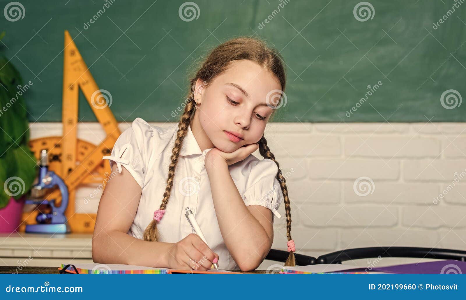 Hooked On Learning. Girl Cute Child Sit School Classroom Chalkboard ...