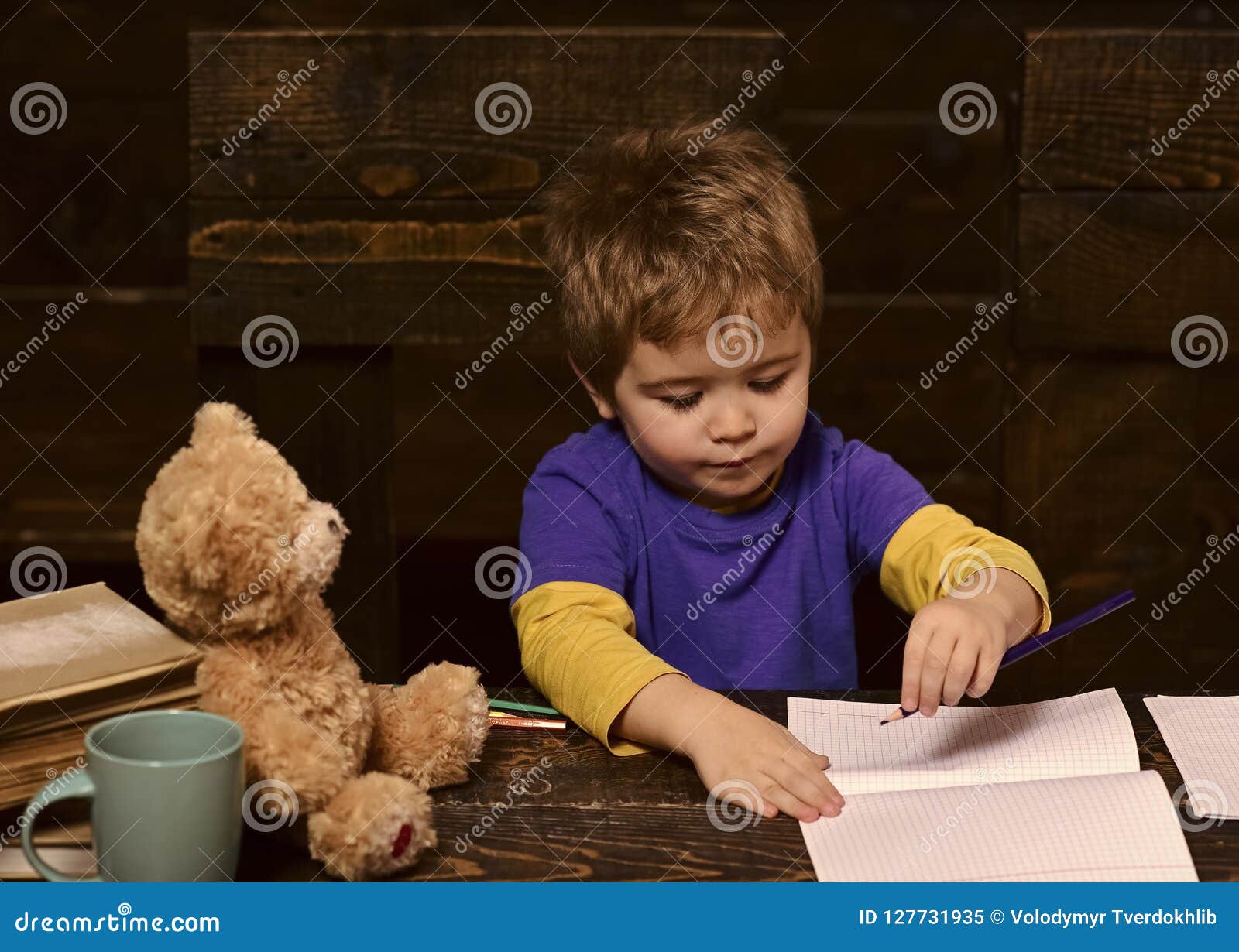 Small Kid Writing in Textbook. Diligent Boy Learning Letters Stock ...