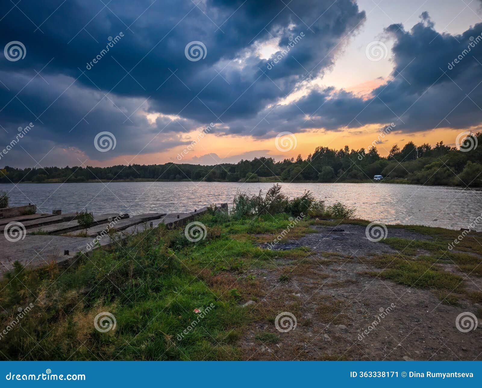 A Small Lake at Sunset with a Dramatic Bright Sky Stock Image - Image ...