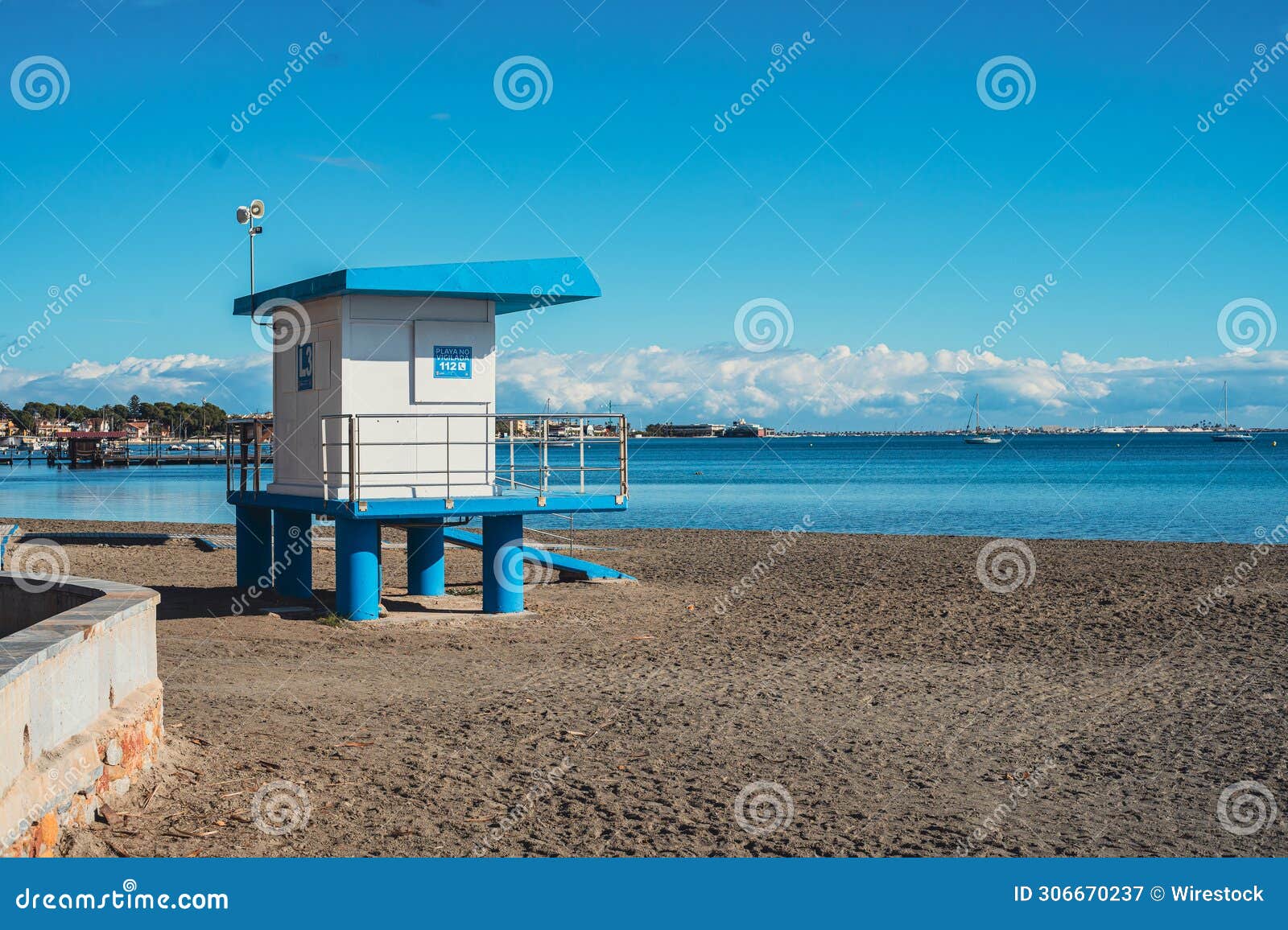 A Small Lifeguard Station Sits on the Edge of a Beach Stock Image ...