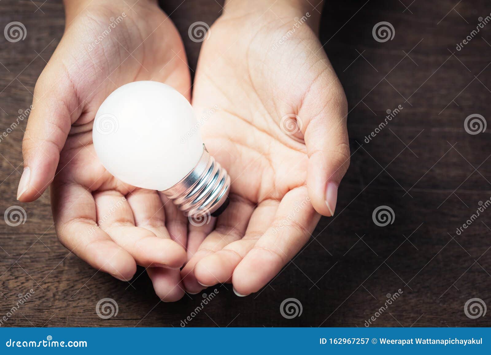 Small Light Bulb in Hands stock image. Image of creative - 162967257