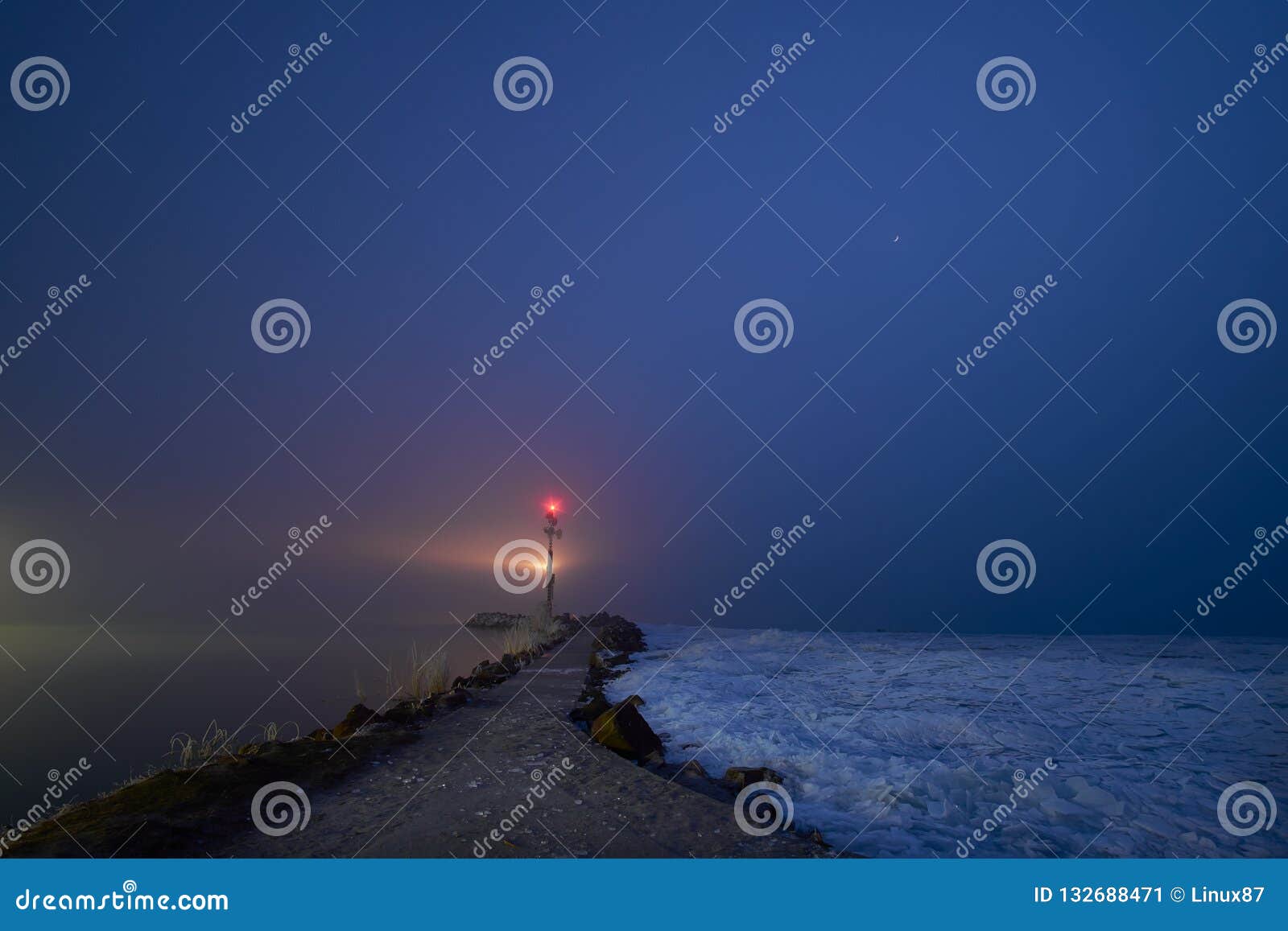 Small Lighthouse in the Lake at Night Stock Image - Image of dramatic ...