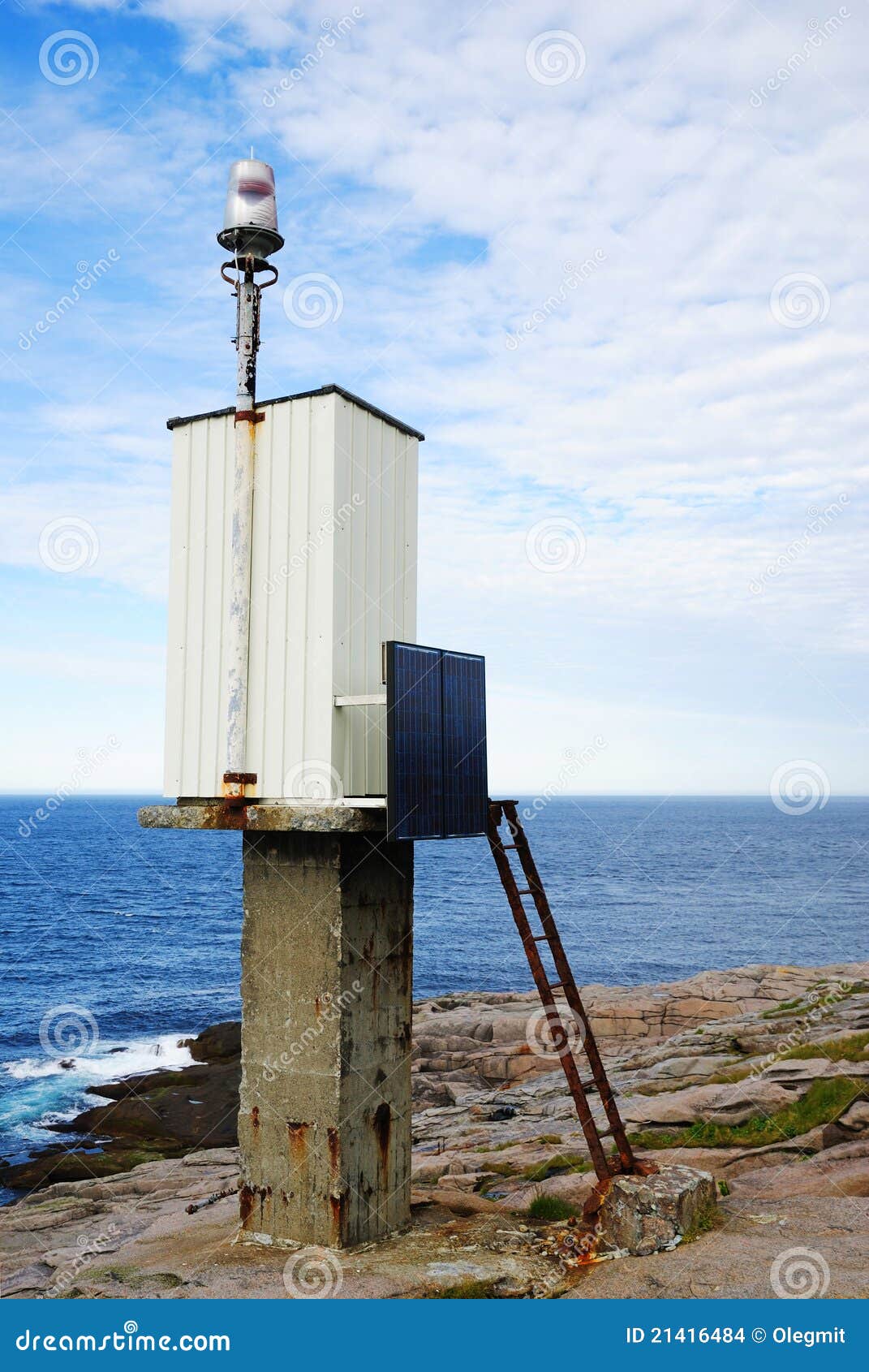 A Small Lighthouse with Solar Battery on the Rock. Stock Photo - Image ...