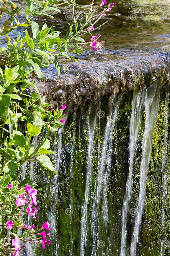 Small Man Made Waterfall in Countryside Stock Image - Image of logs ...