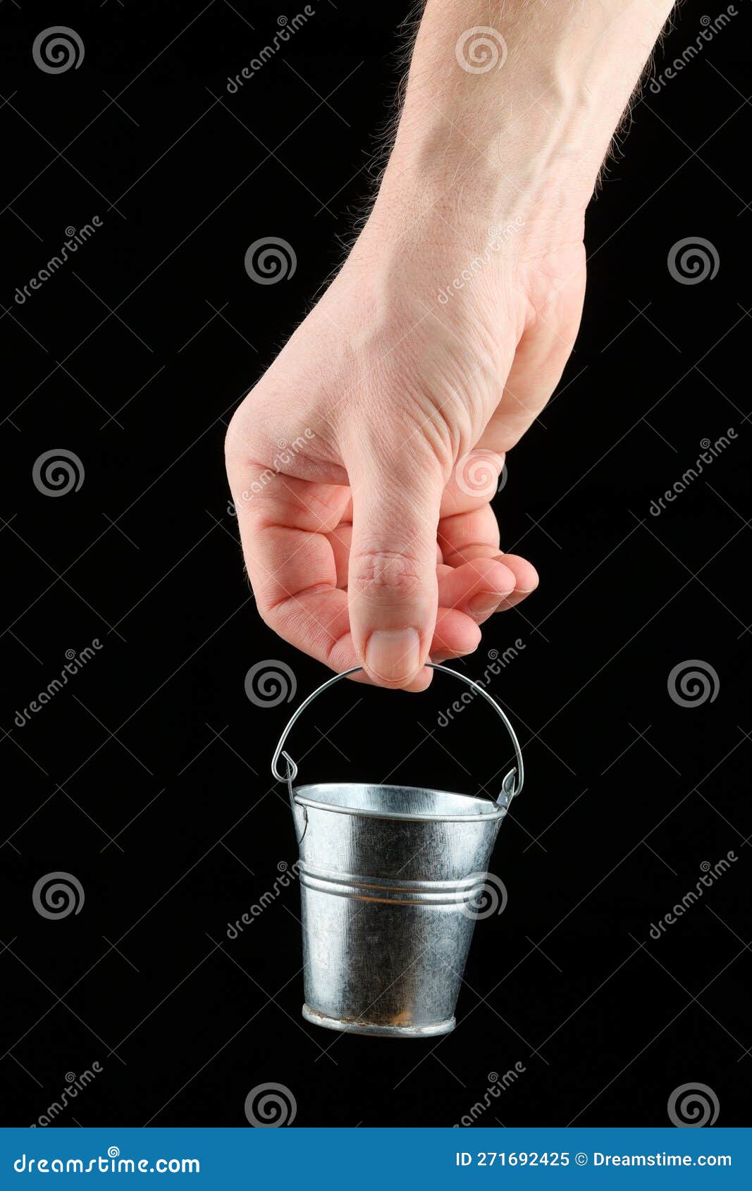 Small metal bucket in hand stock image. Image of steel - 271692425