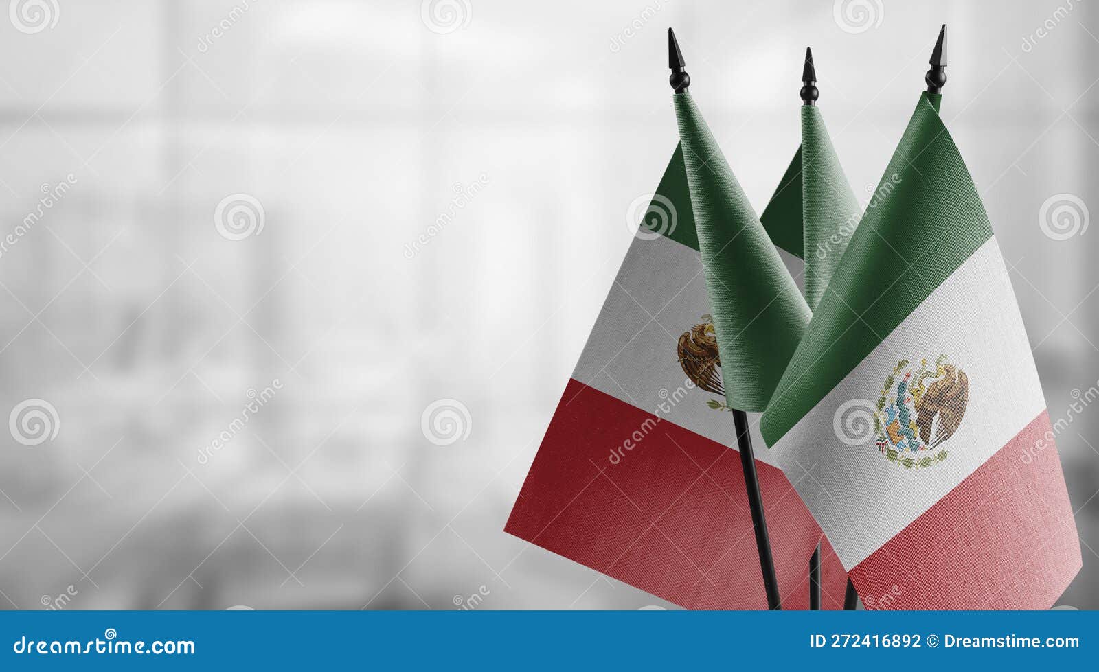 A Small Mexico Flag on an Abstract Blurry Background Stock Photo ...