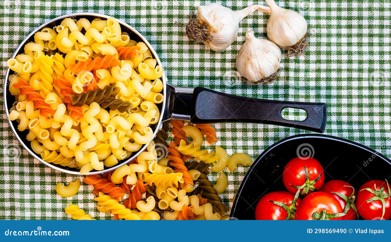 Small Mini Frying Pan with Tricolor Raw Fusilli Pasta in a Rustic ...