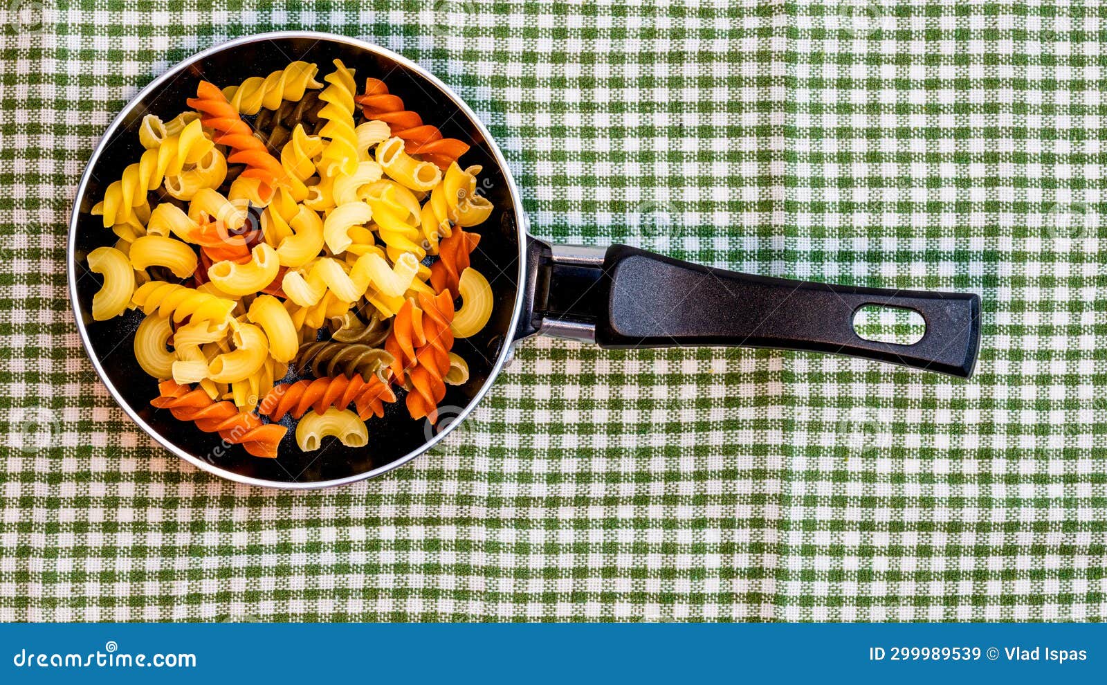 Small Mini Frying Pan with Tricolor Raw Fusilli Pasta in a Rustic ...