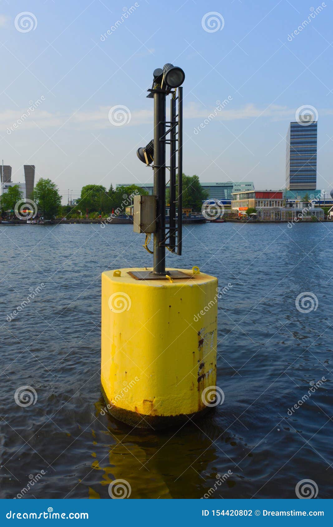 A Small Mini Light Tower in the Canal of a Amsterdam Editorial ...