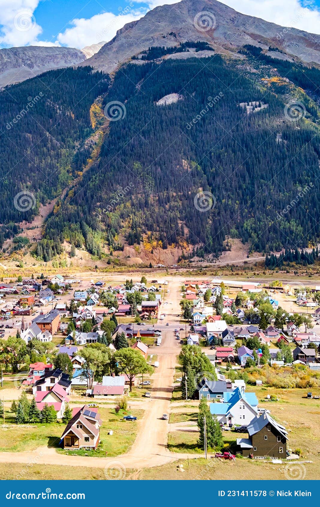 Small Mining Town Against Large Wall of Mountains Stock Photo - Image ...