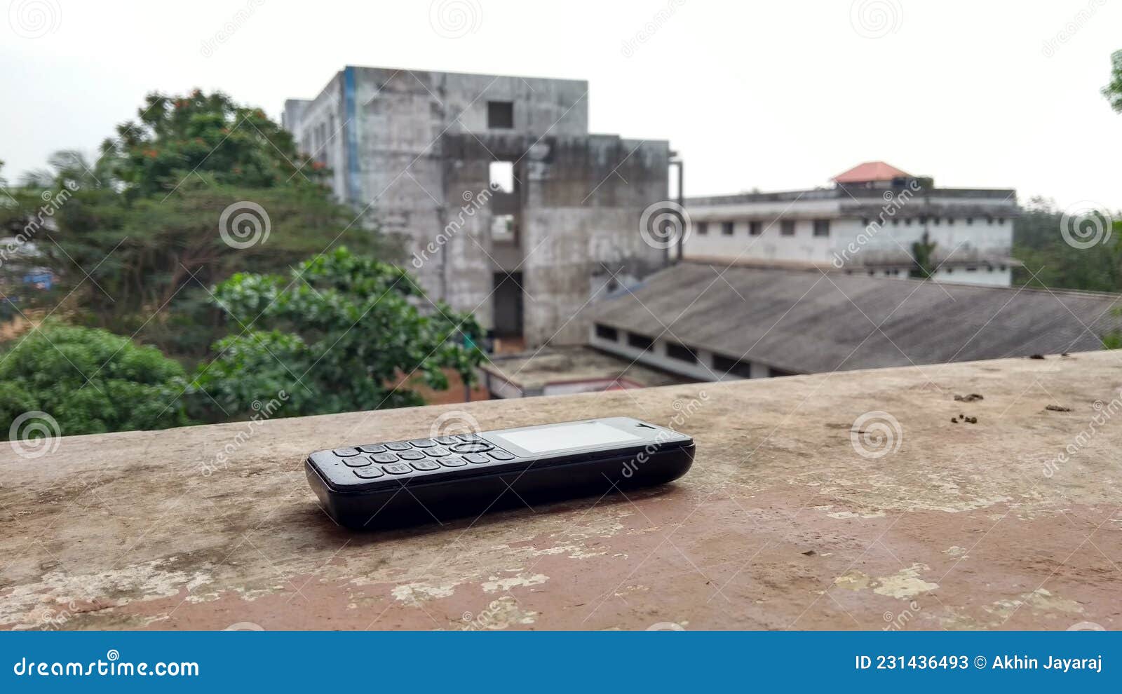 A Small Mobile Phone Placed on the Top of a Building Stock Image ...