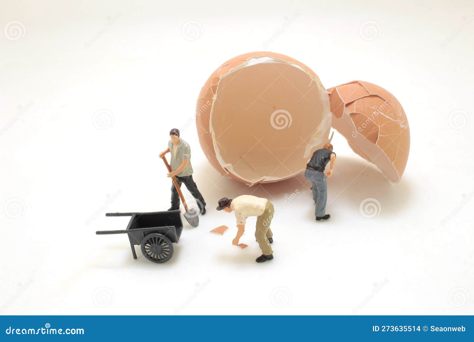 A Small Model Human Figure Cleaning Broken of Chicken Shell Stock Photo ...