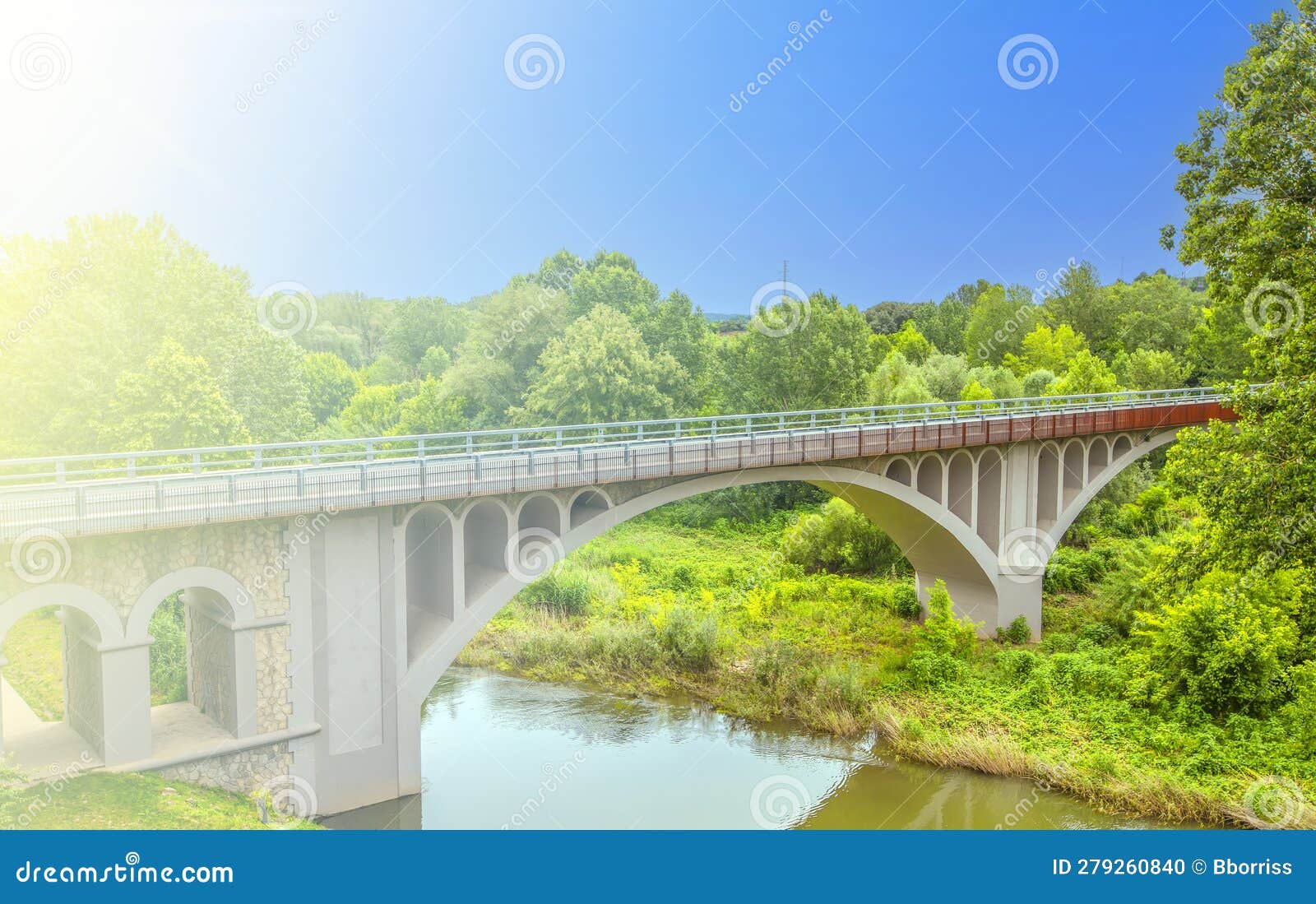 Small Modern Bridge Across the River in Soft Sunlight Stock Photo ...