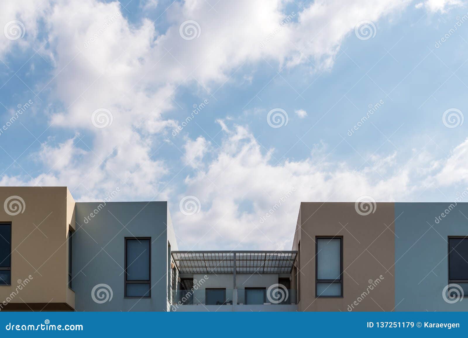 Small Modern Building Against a Nice Cloudy Sky Background Stock Image ...