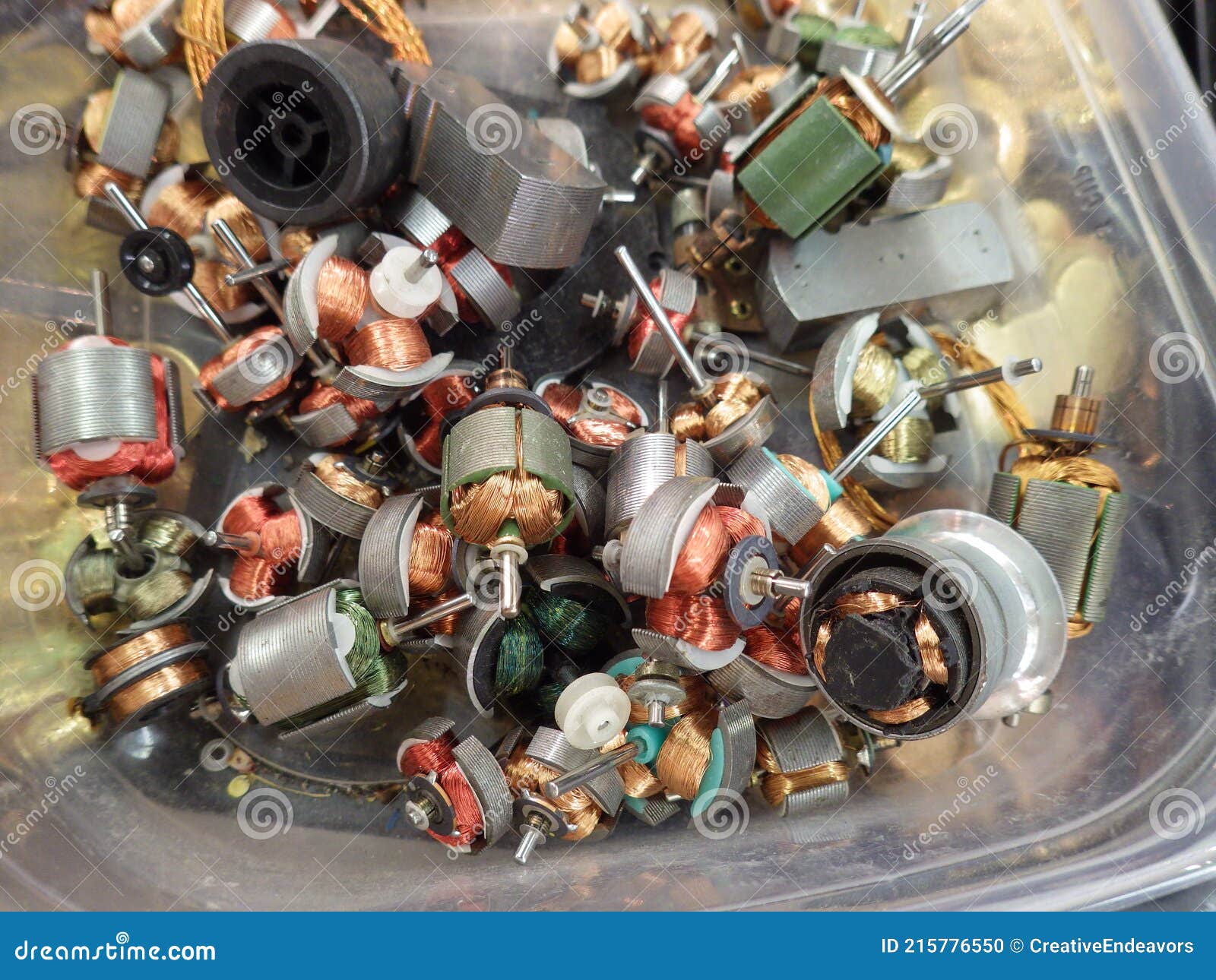 Small Electric Motors in Container Showing Windings and Shafts Stock ...