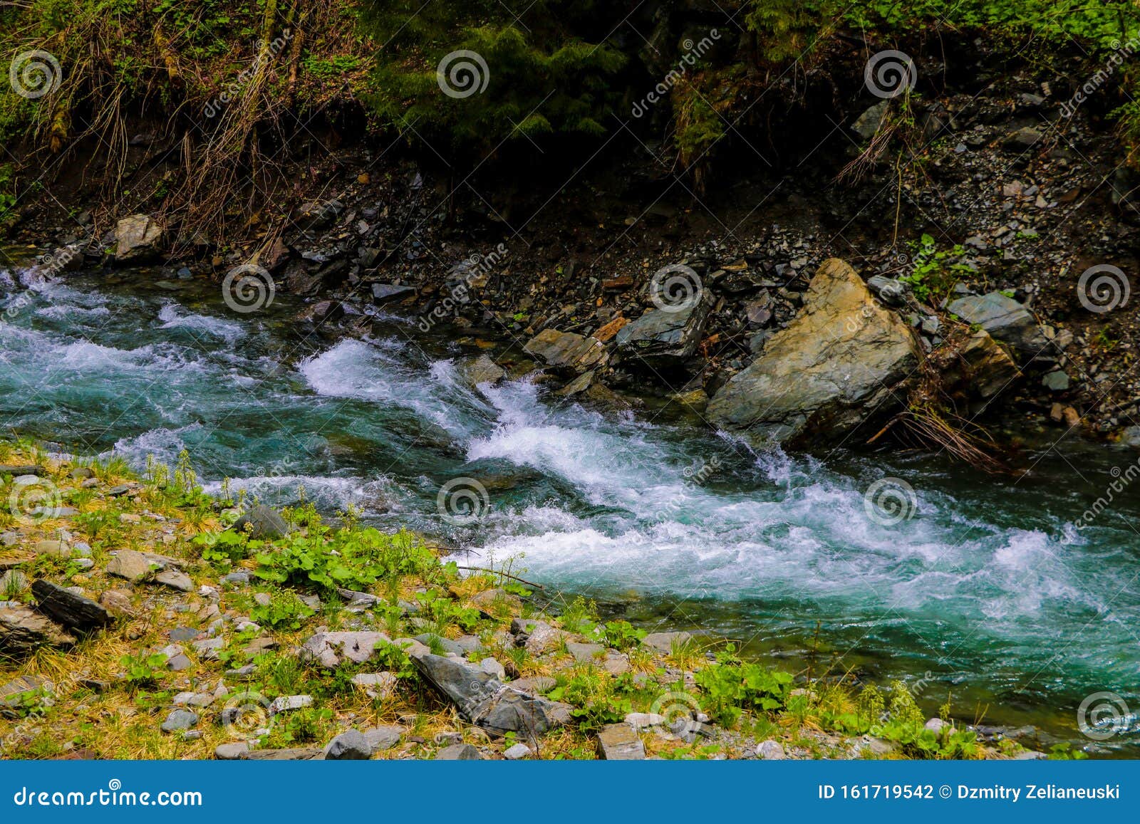 A Small Mountain Cold Stream Drains Quickly from the Mountains Stock ...