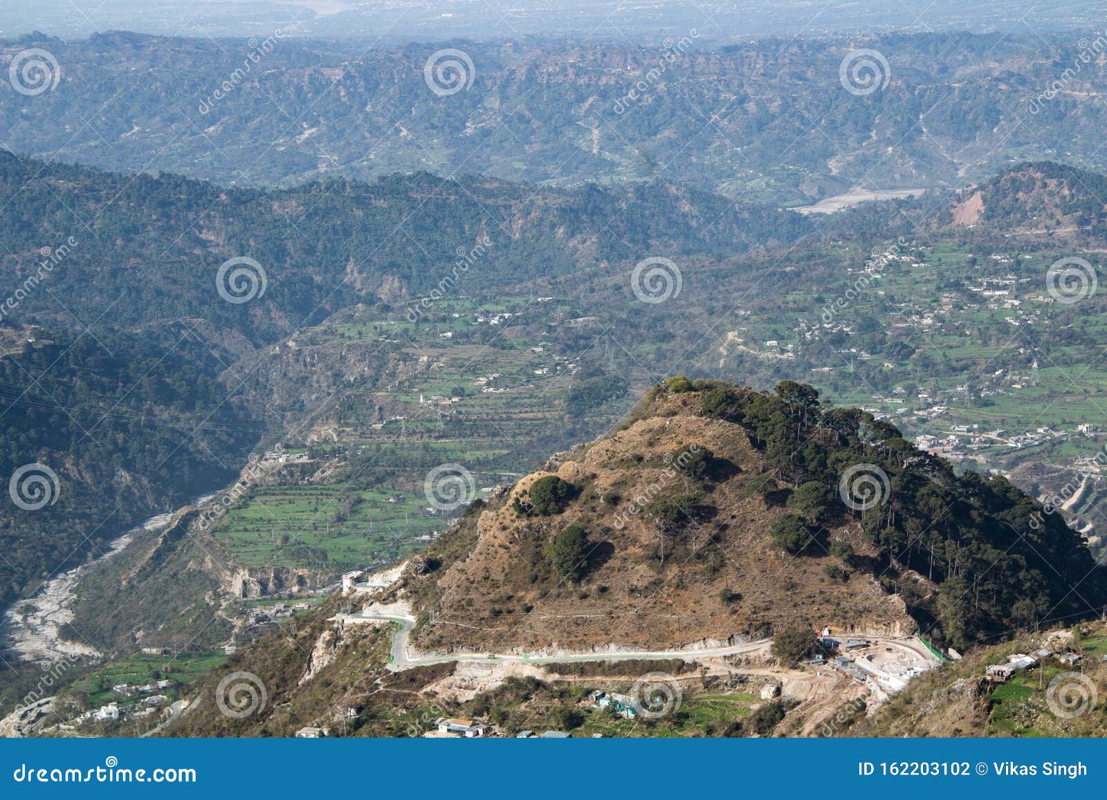 A Small Mountain in One Third Frame with Wide Hill Ranges in the ...