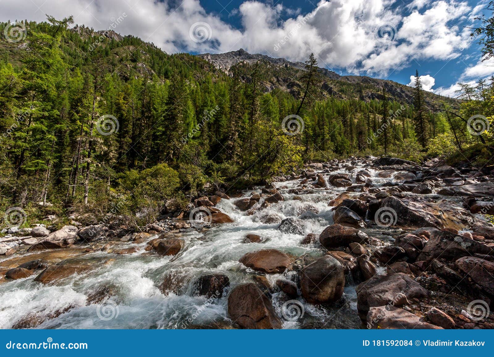 A Small Mountain Stream Flows among Large Stones. Stock Photo - Image ...