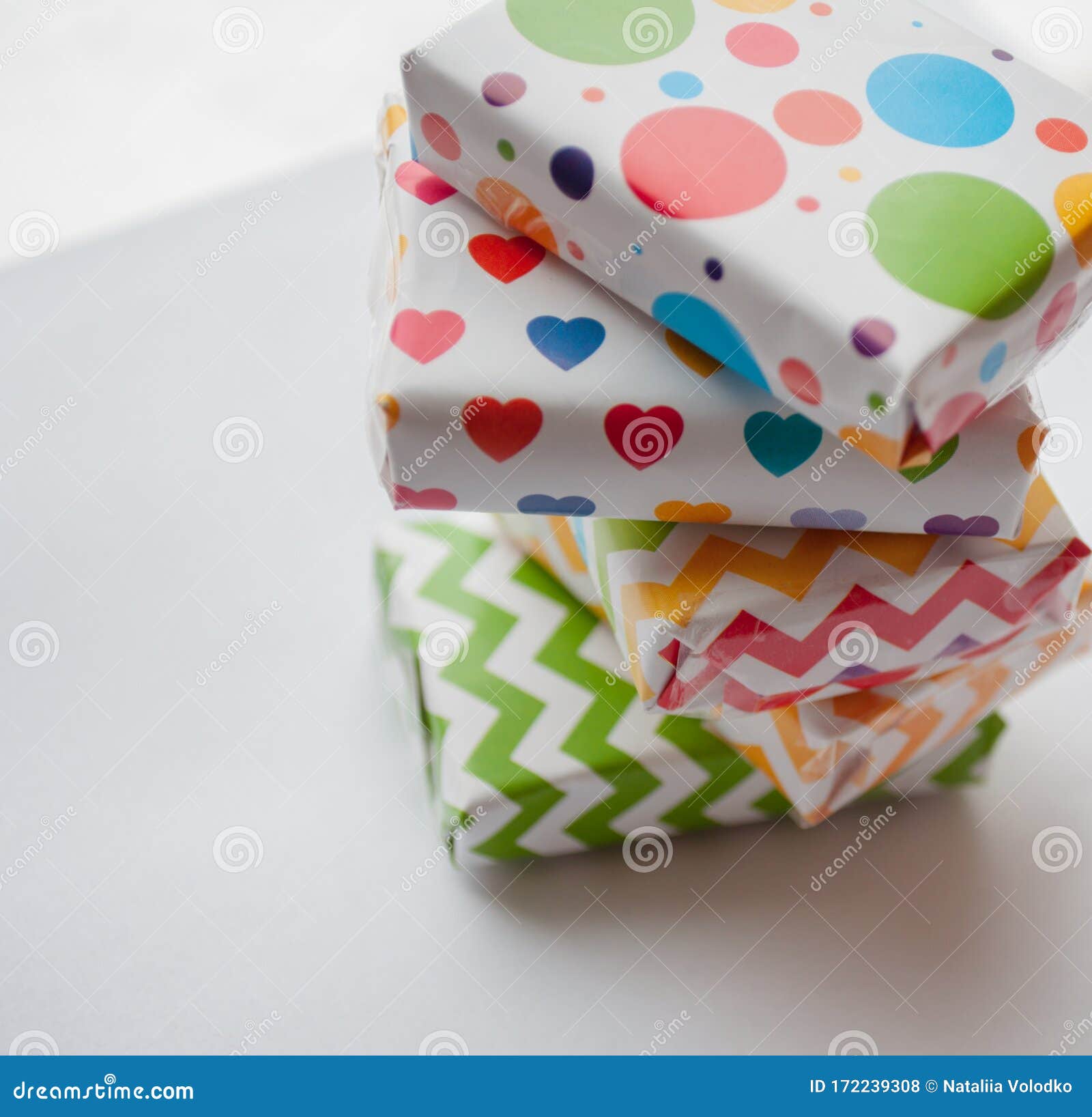 Small Multi-colored Boxes for a Festive Style on a White Background ...