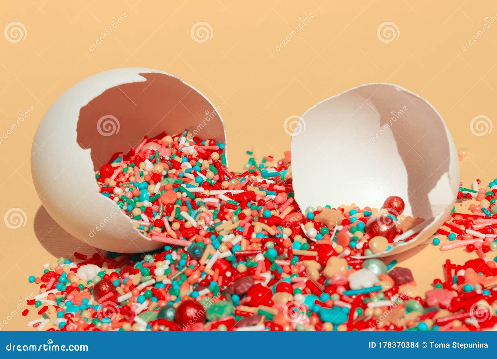 Small Multi-colored Sweets in a Broken White Egg Shell on Pink ...