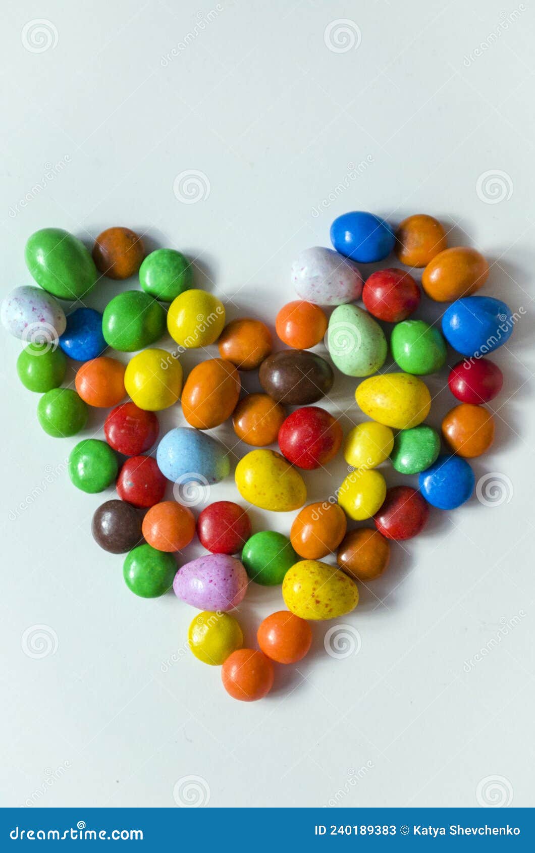 Small Multi-colored Sweets in the Form of a Heart on a White Background ...