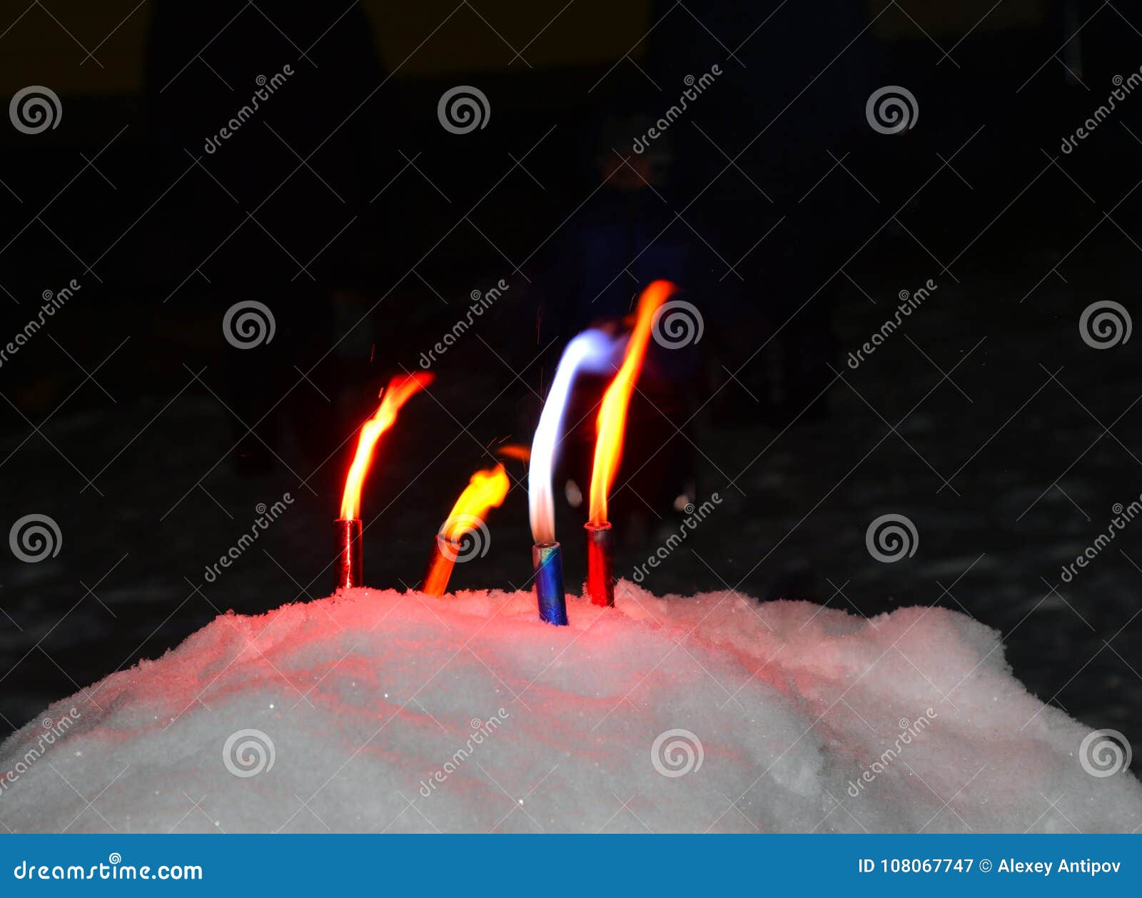 Small Multicolored Torches Standing in Snow Stock Image - Image of ...