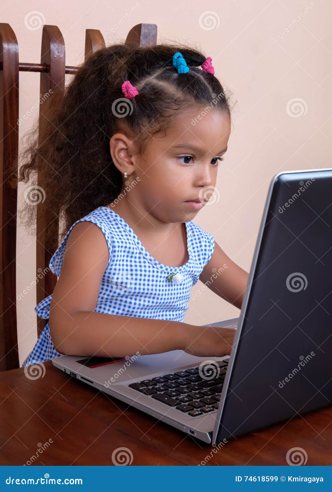 Small Multiracial Girl Working on a Laptop Computer Stock Image - Image ...