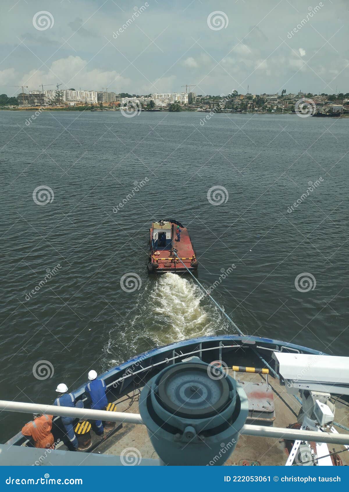 Tugboat Towing Full Loaded Cargo Ship From Port Royalty-Free Stock ... Tugboat Towing Full Loaded Cargo Ship From Port Royalty-Free Stock ...
