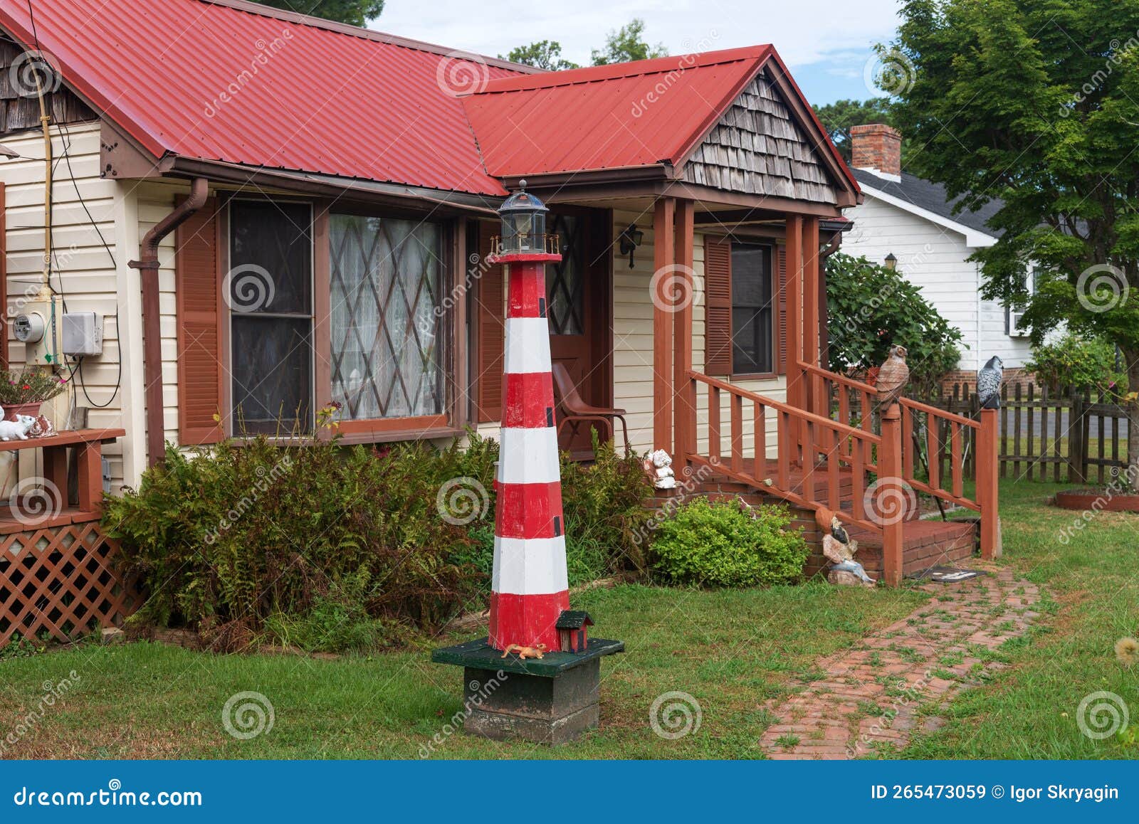 Small One-story Residential Building with a Lighthouse in the Yard ...