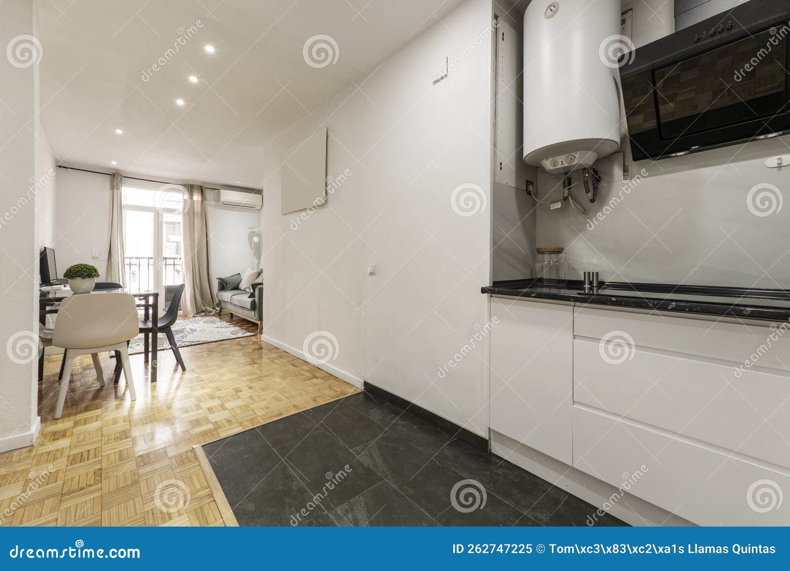 Small Open Plan Kitchen of a Studio Apartment with Dining Table and ...
