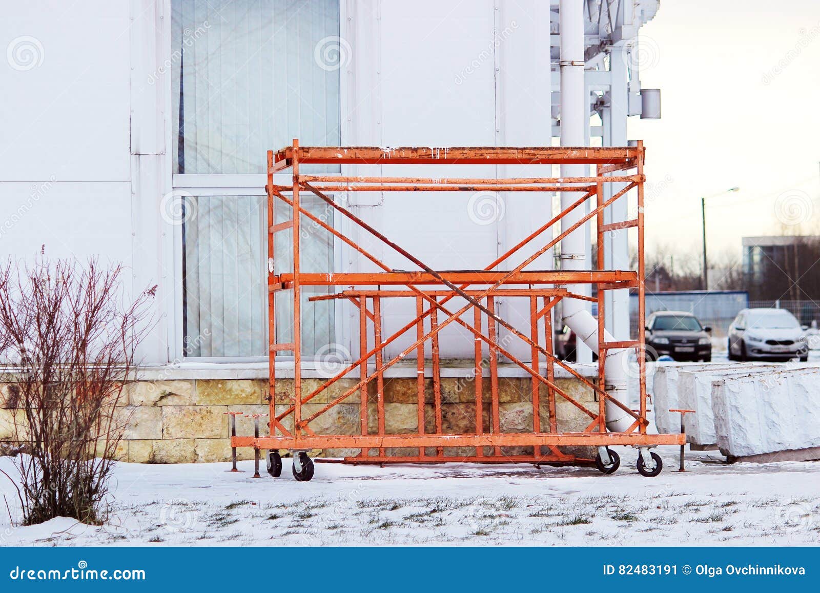 Small Orange Building Mobile Work Scaffolding Near a Large Sports ...