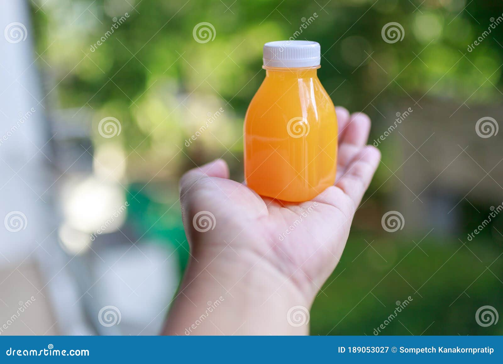 Small Orange Juice Bottle On Hand Stock Image Image Of Container Nature 189053027