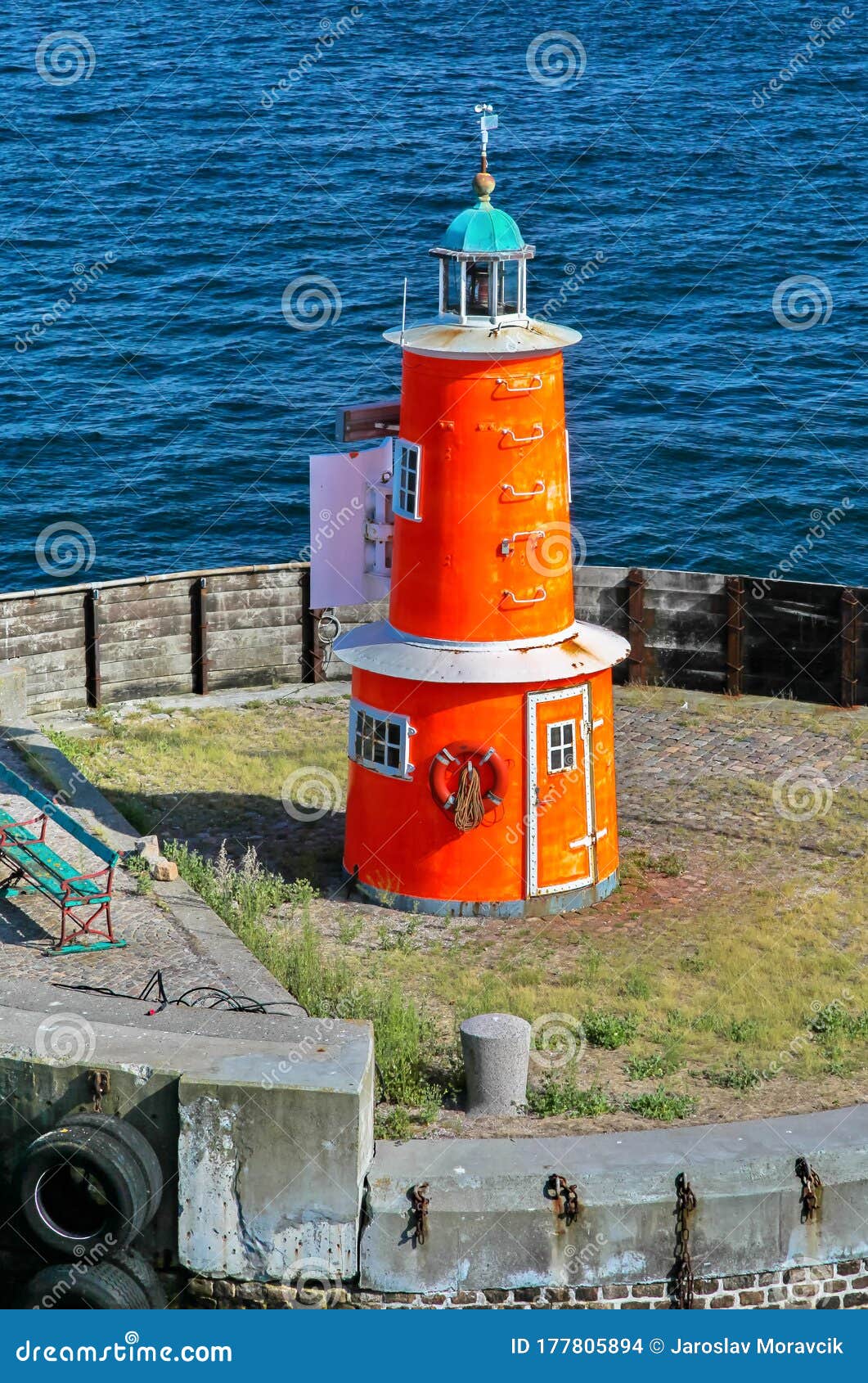 Small orange lighthouse stock photo. Image of landmark - 177805894