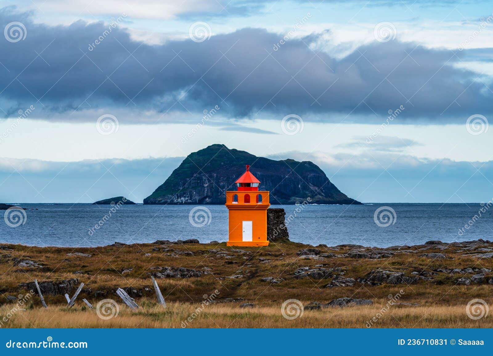 Orange Lighthouse with Huge Islet in the Distance Stock Image - Image ...
