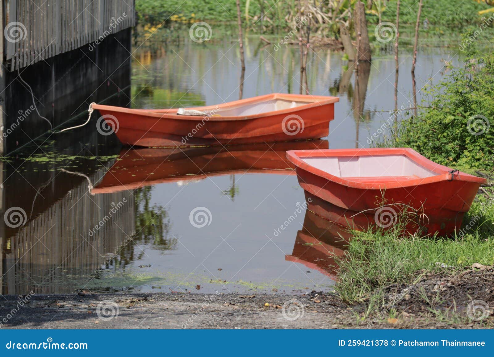A Small Orange Plastic Boat Used for Flooding in Thailand. Stock Photo ...