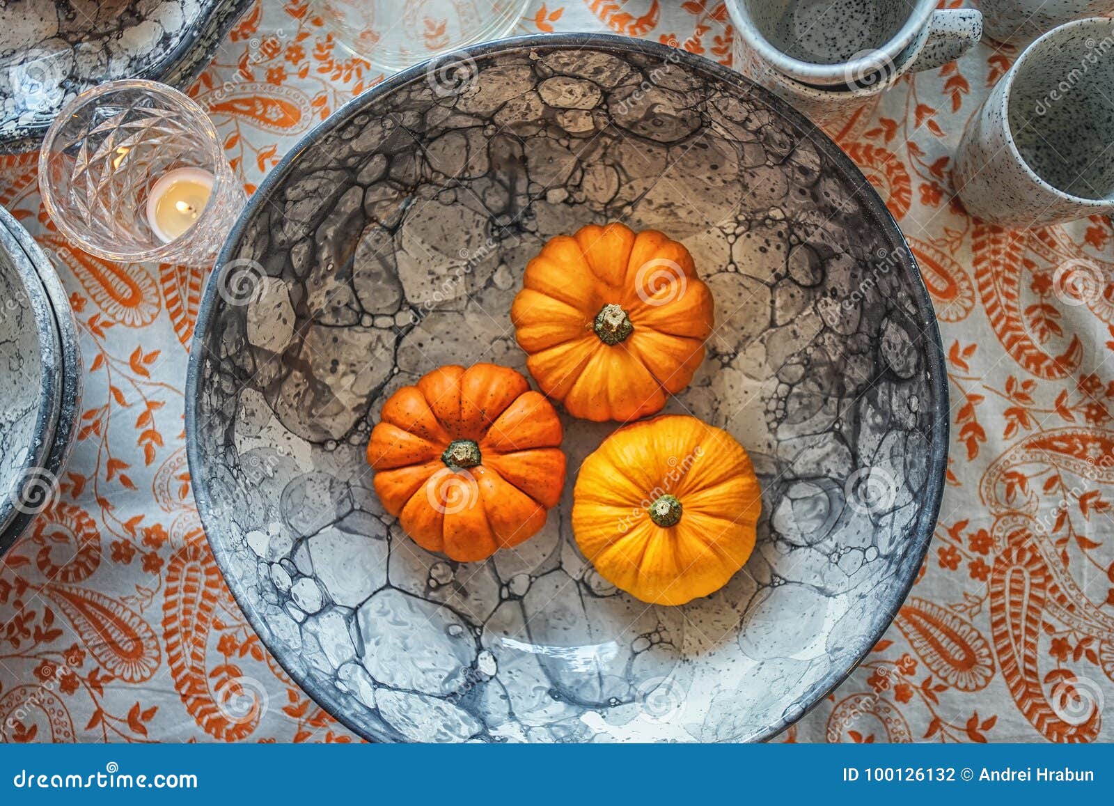 Small Orange Pumpkin on a Ceramic Plate Stock Photo - Image of plate ...