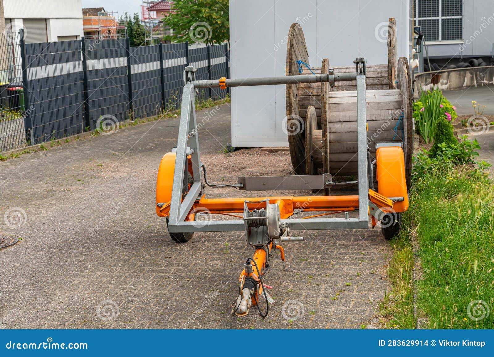Small Orange Trailer for Transporting Reels of Cables. Stock Photo ...