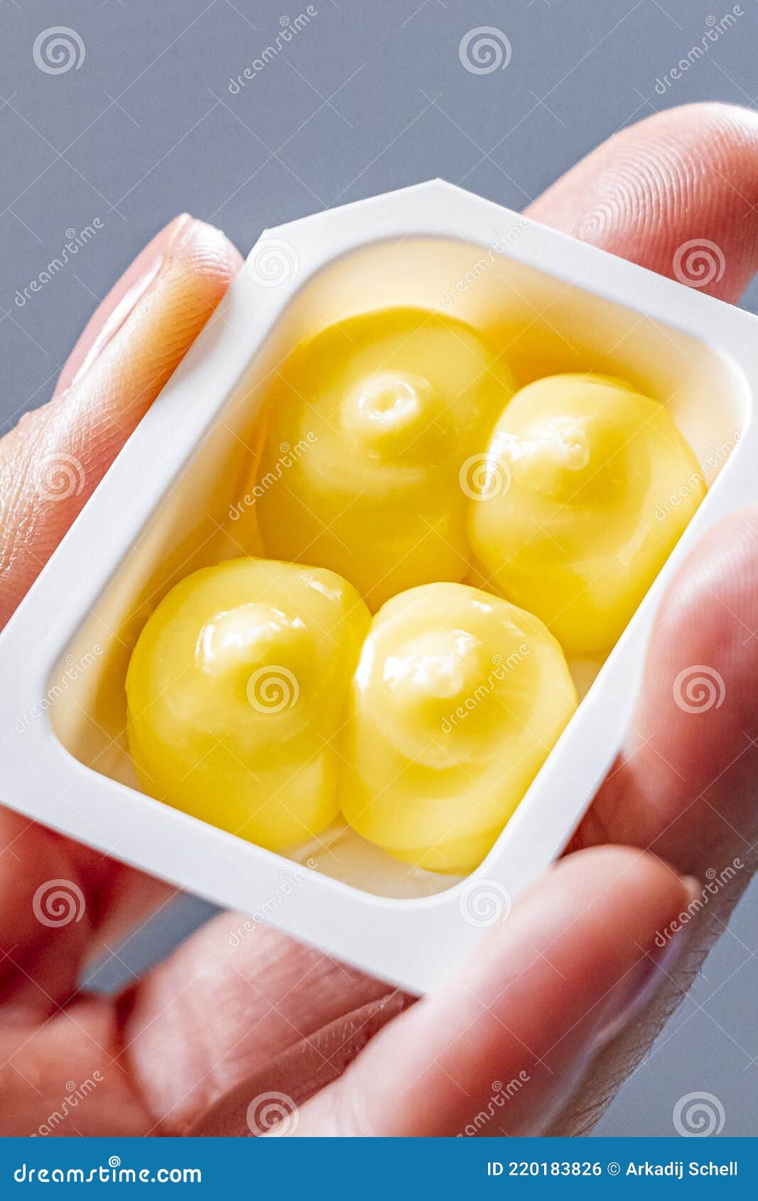 Small Packet of Butter in Hand on the Plane Stock Photo - Image of ...