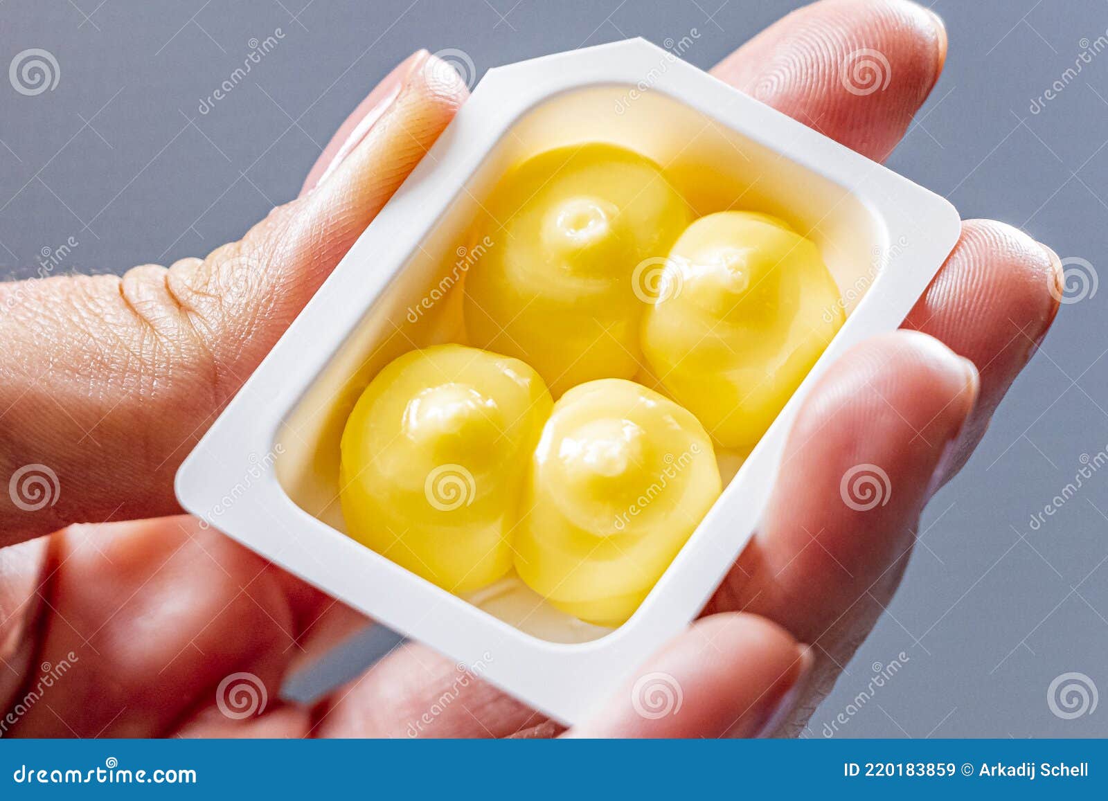 Small Packet of Butter in Hand on the Plane Stock Image - Image of ...