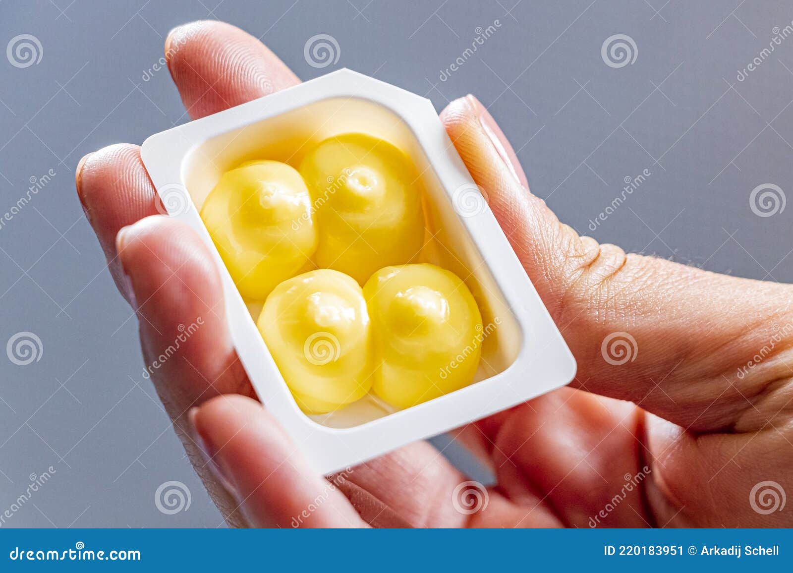 Small Packet of Butter in Hand on the Plane Stock Image - Image of ...