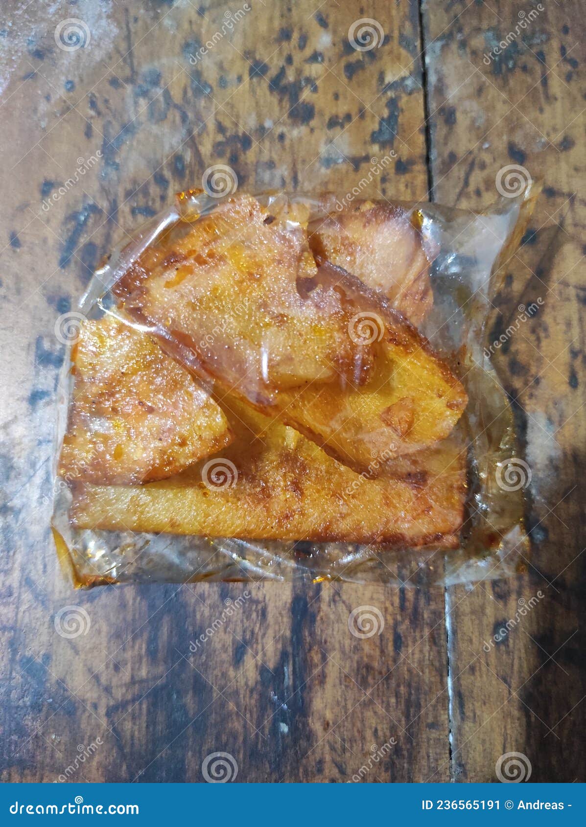 A Small Packet of Sweet Potato Chips on a Wooden Table Stock Image ...