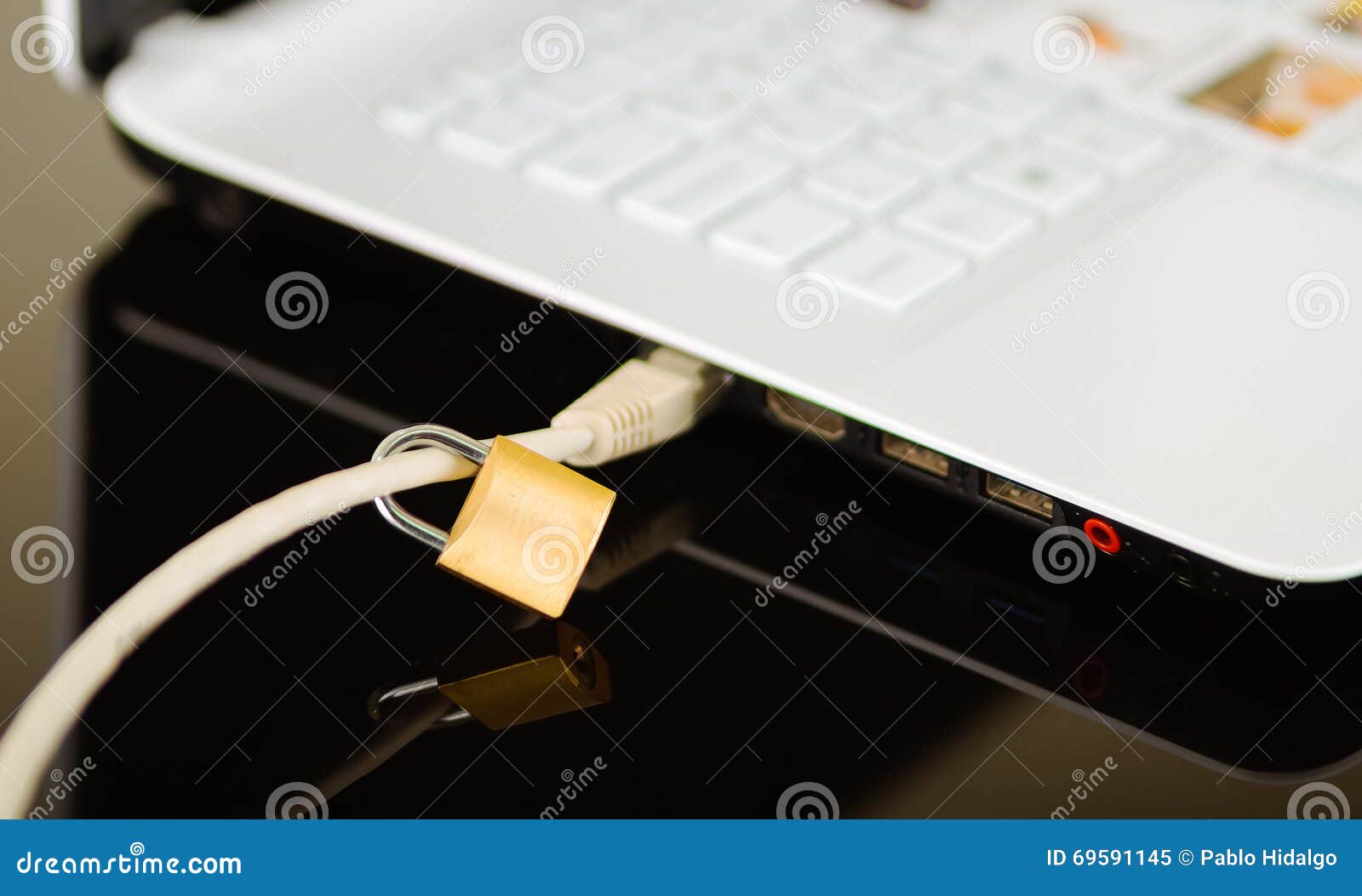 Small Padlock Locked Around Ethernet Cable Connected into Side of ...