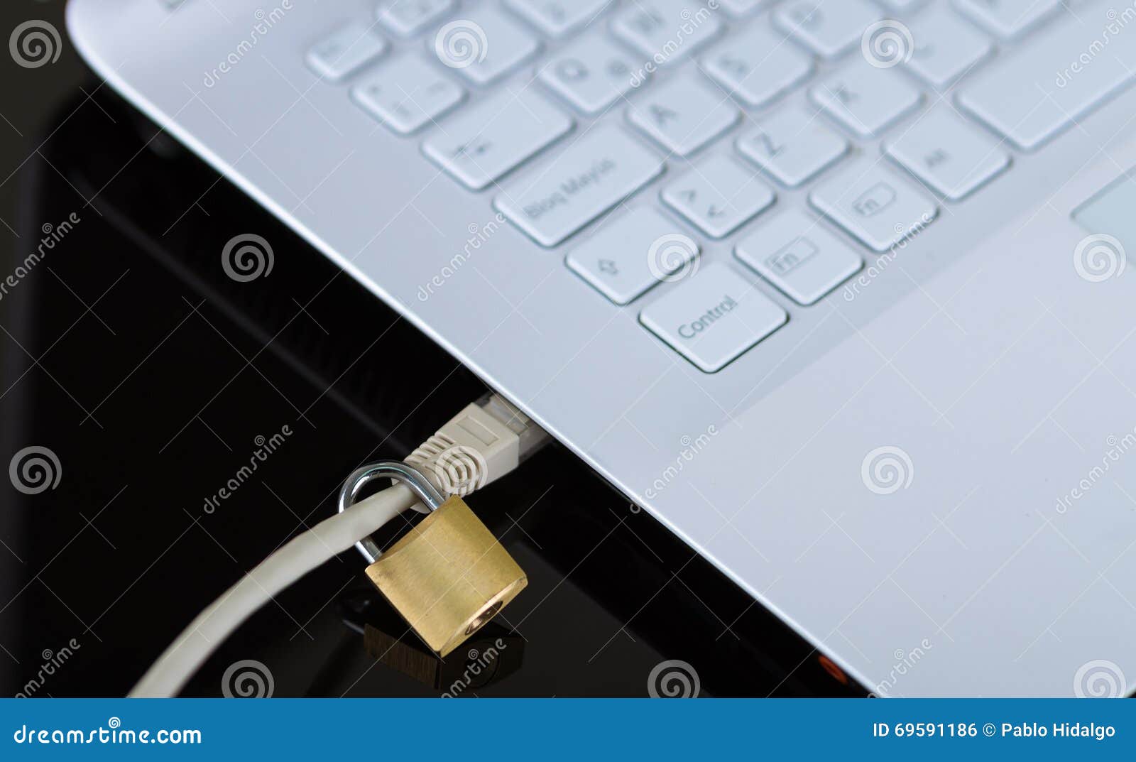 Small Padlock Locked Around Ethernet Cable Connected into Side of ...