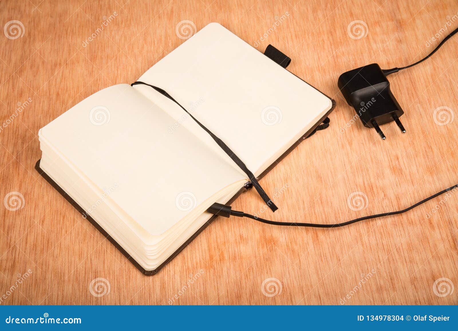 Small Paper Notebook and Battery Charger Stock Photo - Image of antique ...