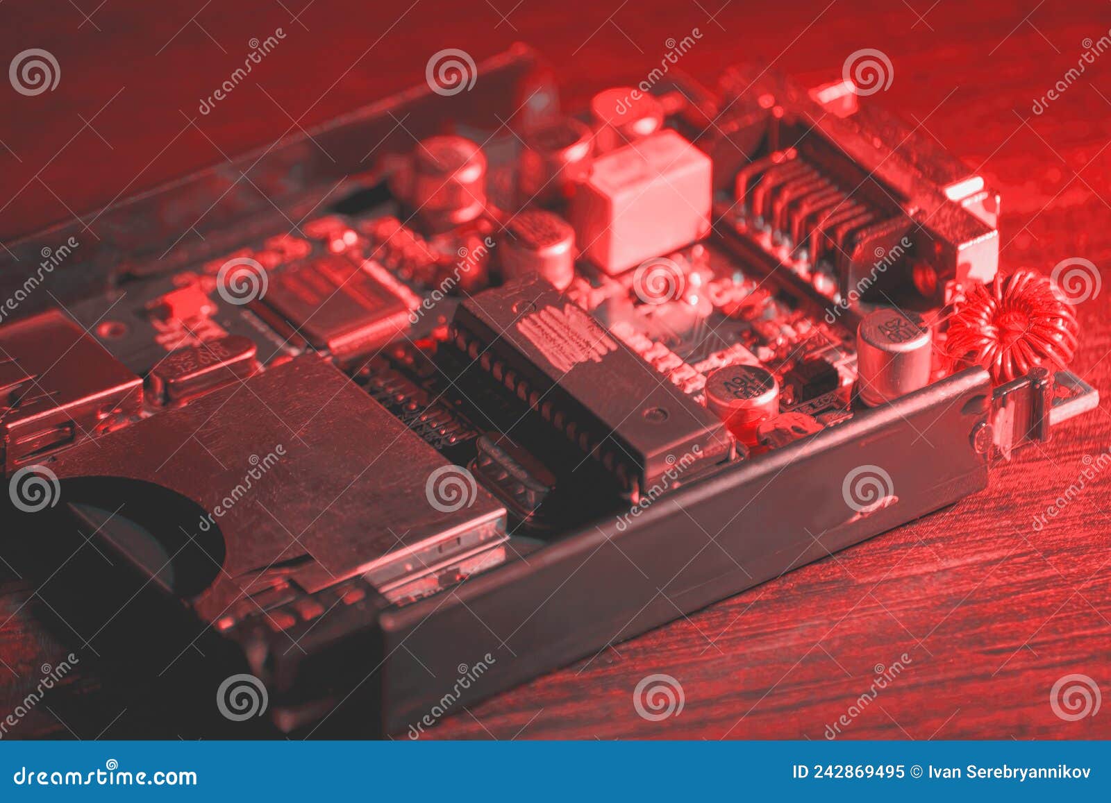 Small PCB and Processor on the Table in the Pink Neon Lights Stock ...