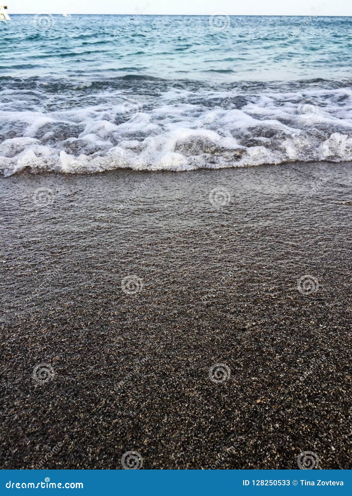 Small pebbles on a beach stock image. Image of water - 128250533