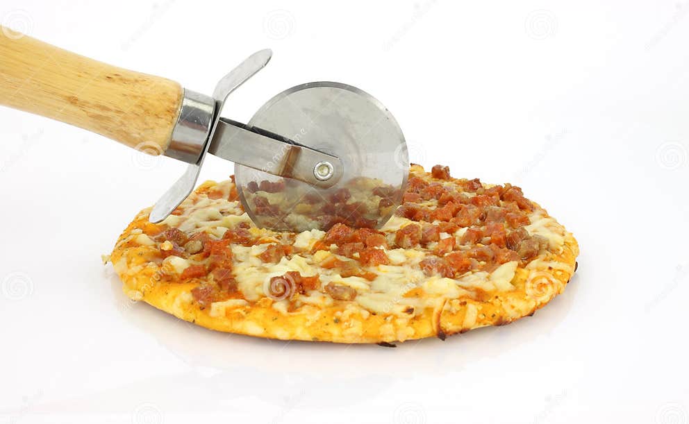 Small Pepperoni Pizza Being Cut Stock Photo - Image of single, thin ...