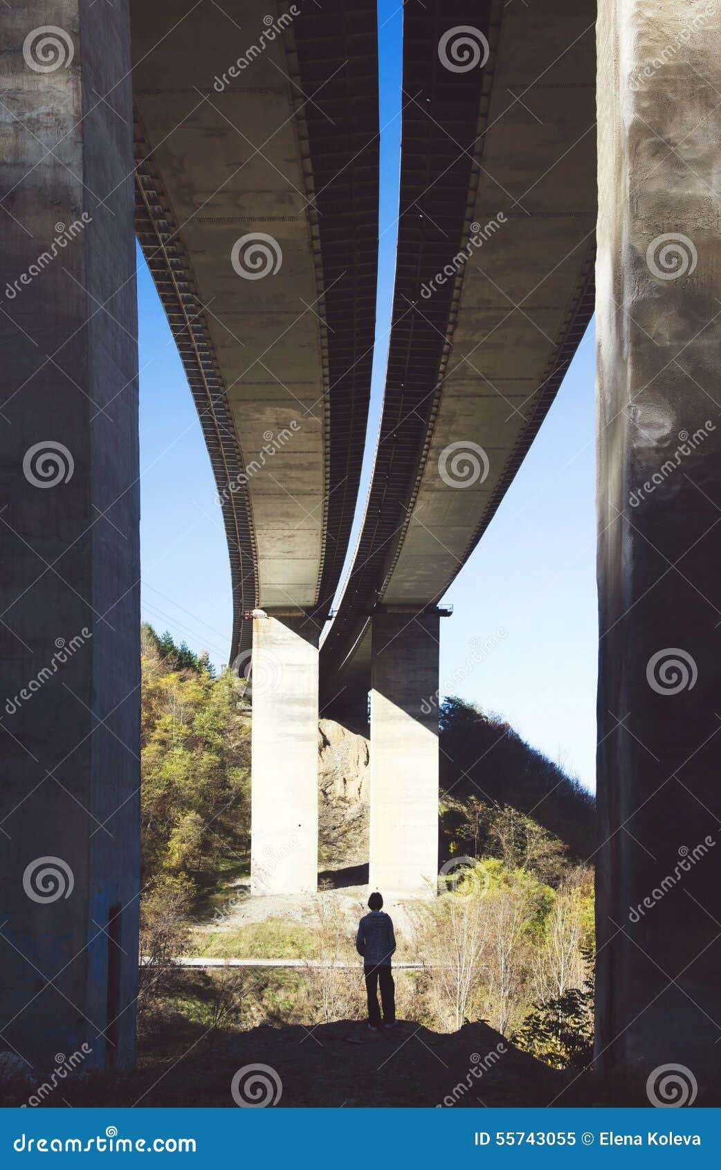 Small Person Under a Big Bridge Stock Image - Image of young, small ...