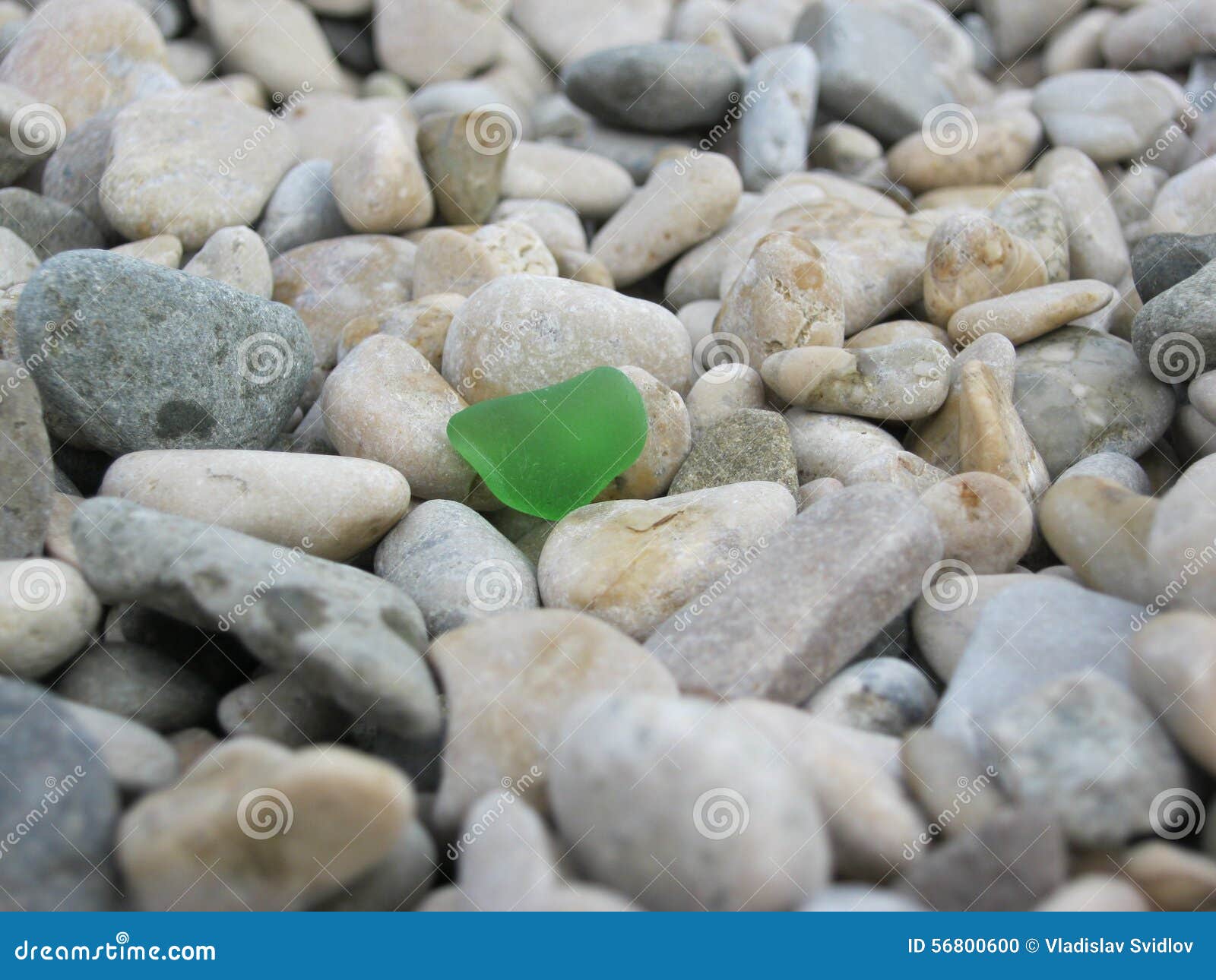A Small Piece of Glass on the Background of Rocks Stock Photo - Image ...